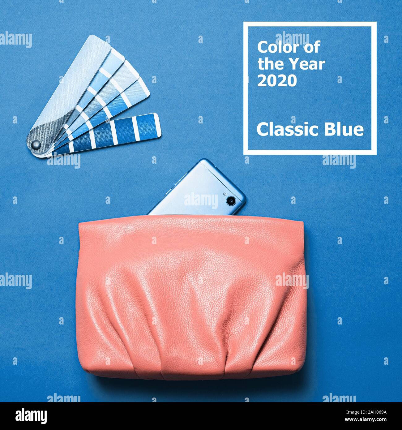 Pink coral female leather bag over classic blue 2020 color background ...