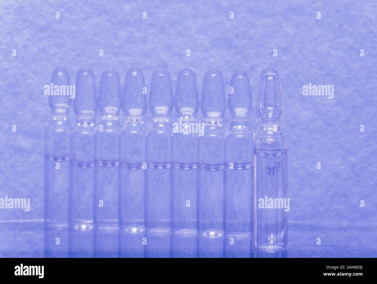 Glass medical ampoule vial for injection. Medicine is liquid sodium ...