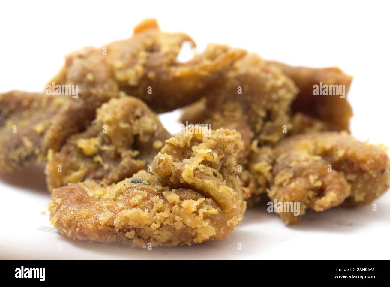 Fried Crispy Chiken Skin isolated on white background Stock Photo - Alamy