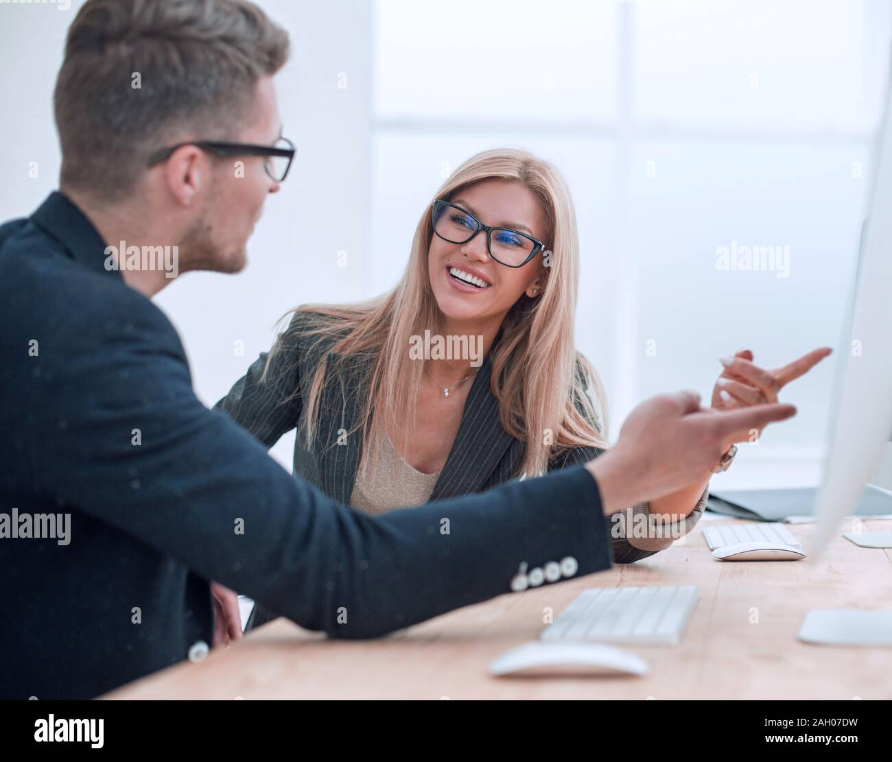 business colleagues pointing to the office computer screen Stock Photo ...