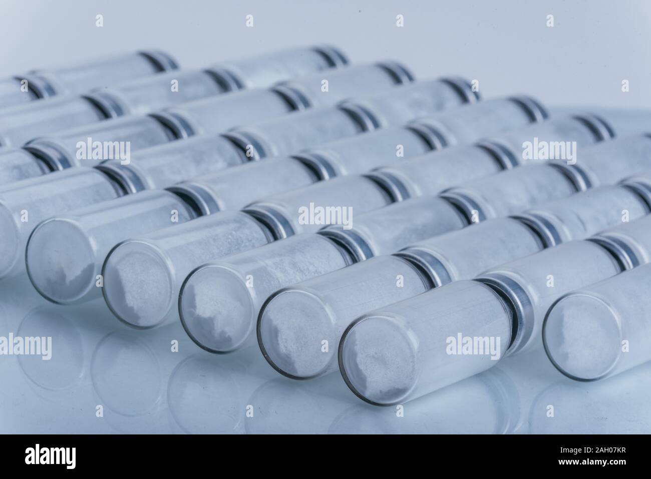 Glass medical ampoule vial for injection. Medicine is dry white drug ...