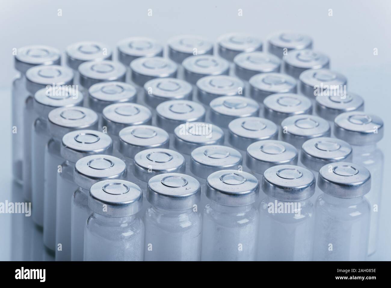 Glass medical ampoule vial for injection. Medicine is dry white drug ...