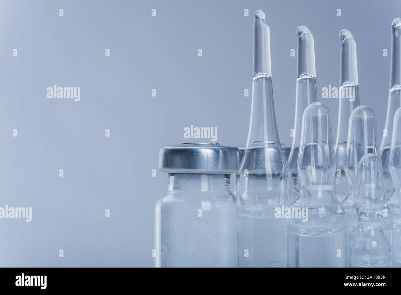 Glass medical ampoule vial for injection. Medicine is dry white drug ...