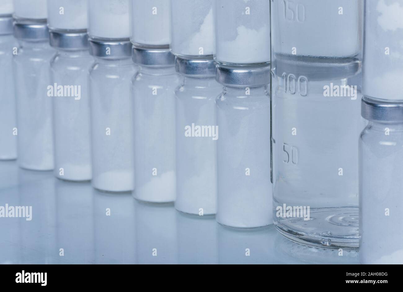 Glass medical ampoule vial for injection. Medicine is dry white drug ...