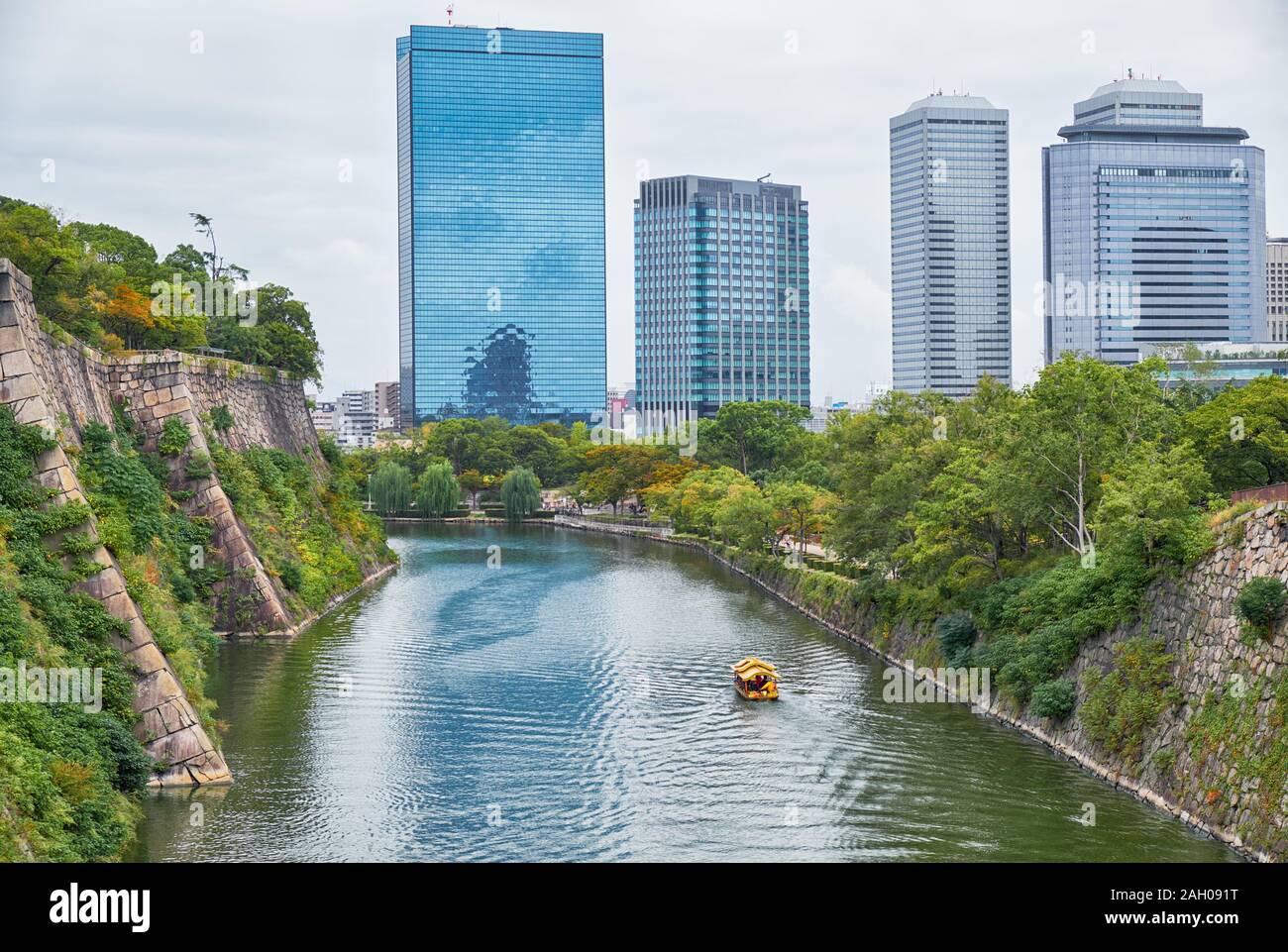 The view along the Inner moat of Osaka Castle with the Osaka Business ...