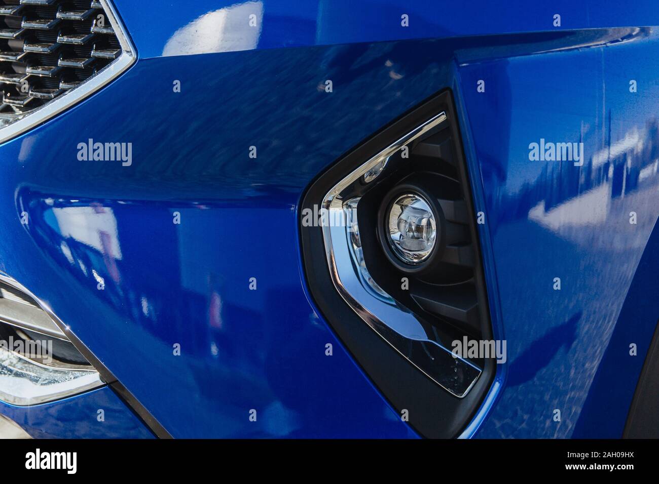 The front fog lights of the car are blue. Front view Stock Photo - Alamy