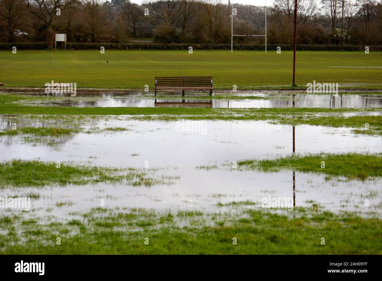 Fordingbridge, Hampshire - Dec 22, 2019: A park bench sits in saturated ...
