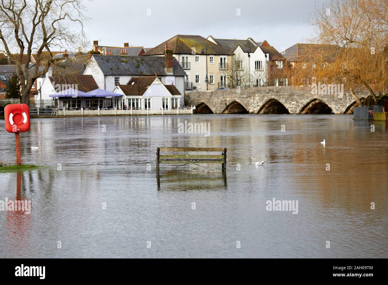 Fordingbridge, Hampshire - Dec 22, 2019: A park bench sits stranded in ...
