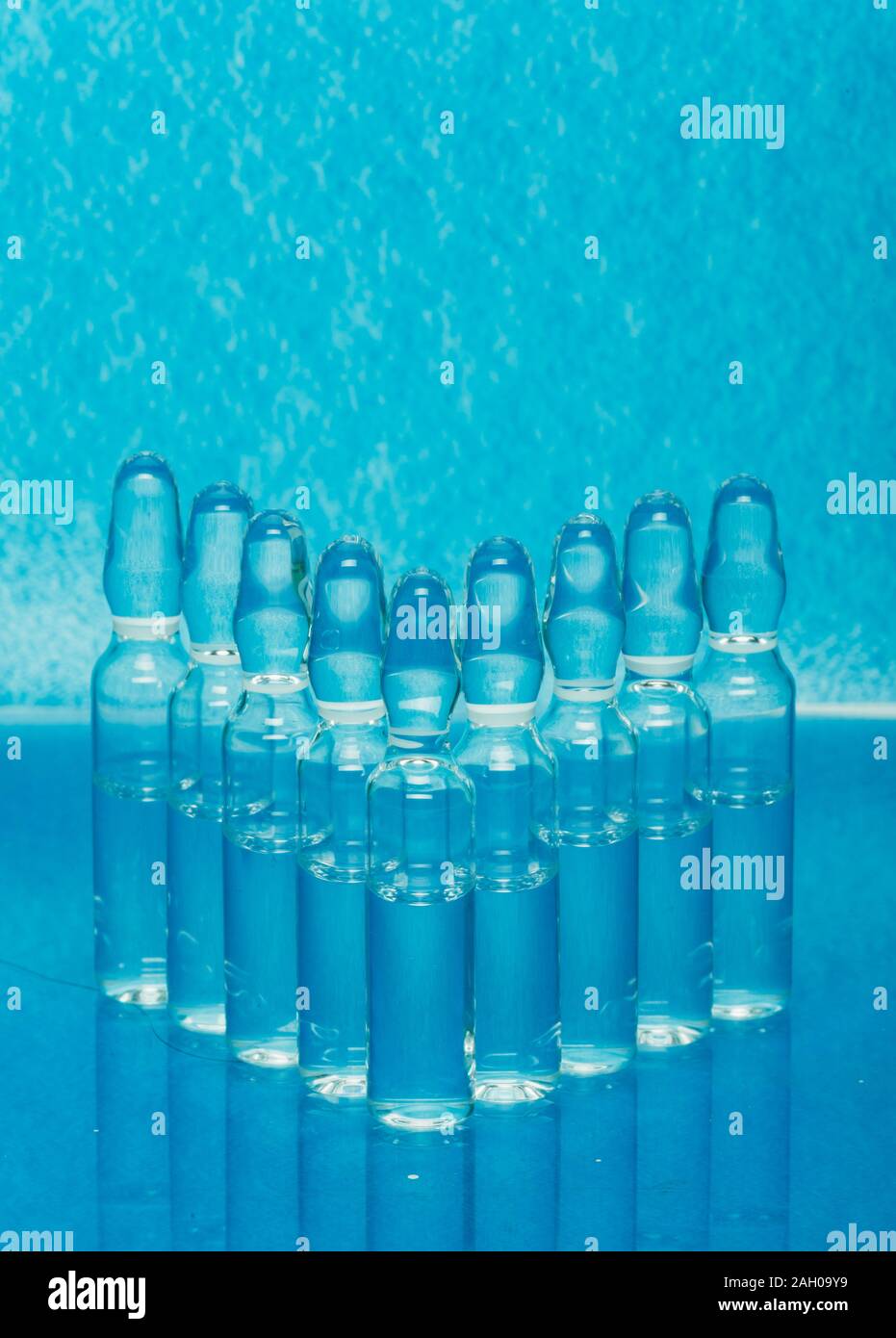 Glass medical ampoule vial for injection. Medicine is liquid sodium ...