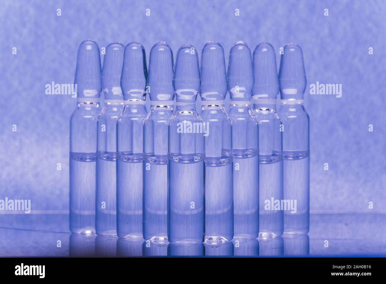 Glass medical ampoule vial for injection. Medicine is liquid sodium ...