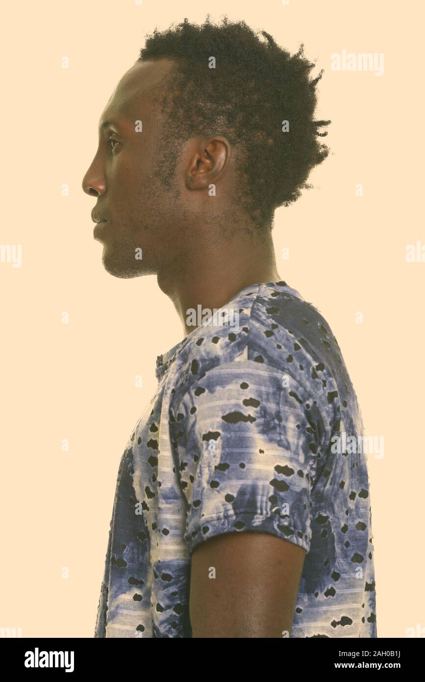 Profile view of young black African man Stock Photo - Alamy