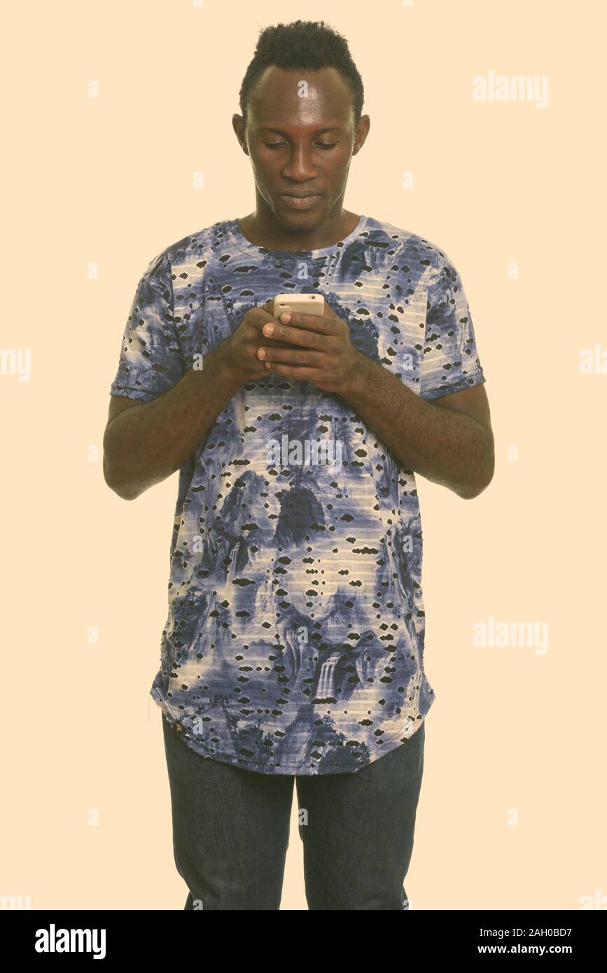 Young black African man using mobile phone Stock Photo - Alamy