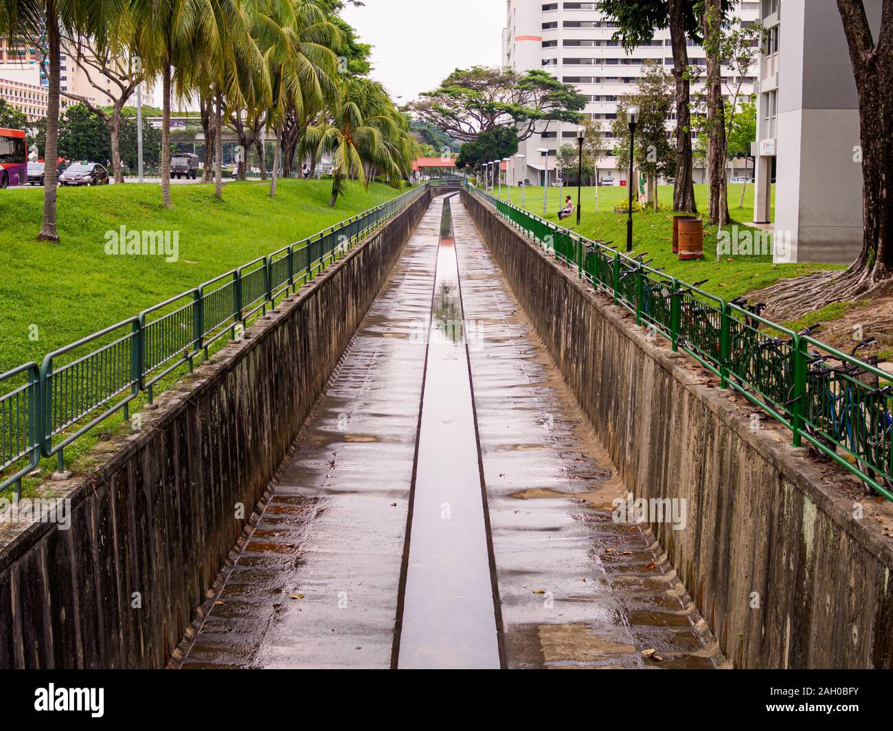 Tree lined water canal channel in a HDB residential housing estate in ...