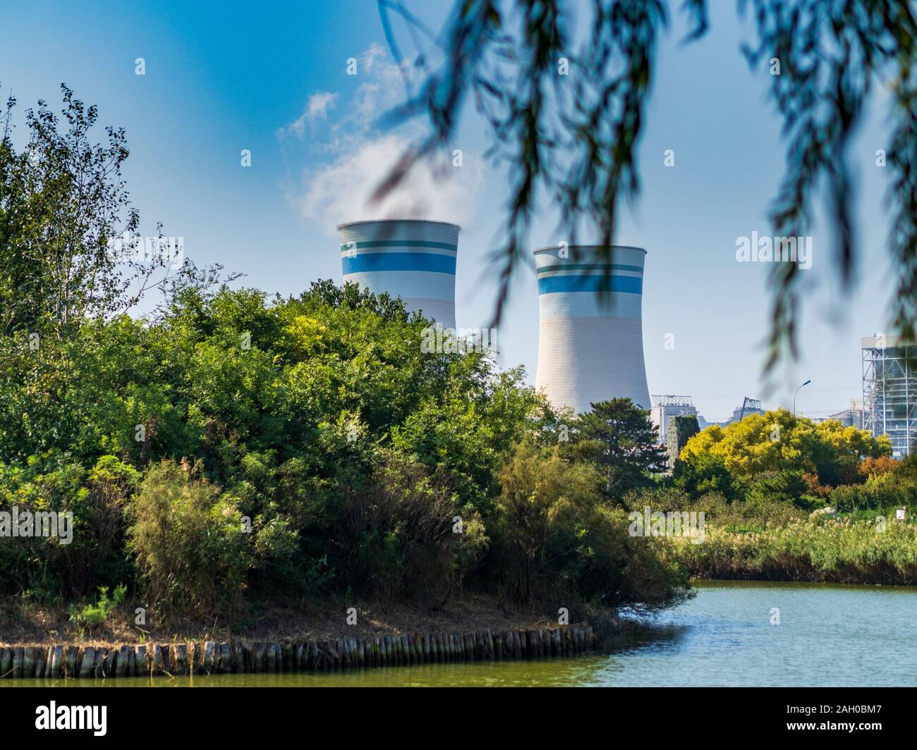 Cooling towers / smokestacks of a nuclear power plant spewing white ...