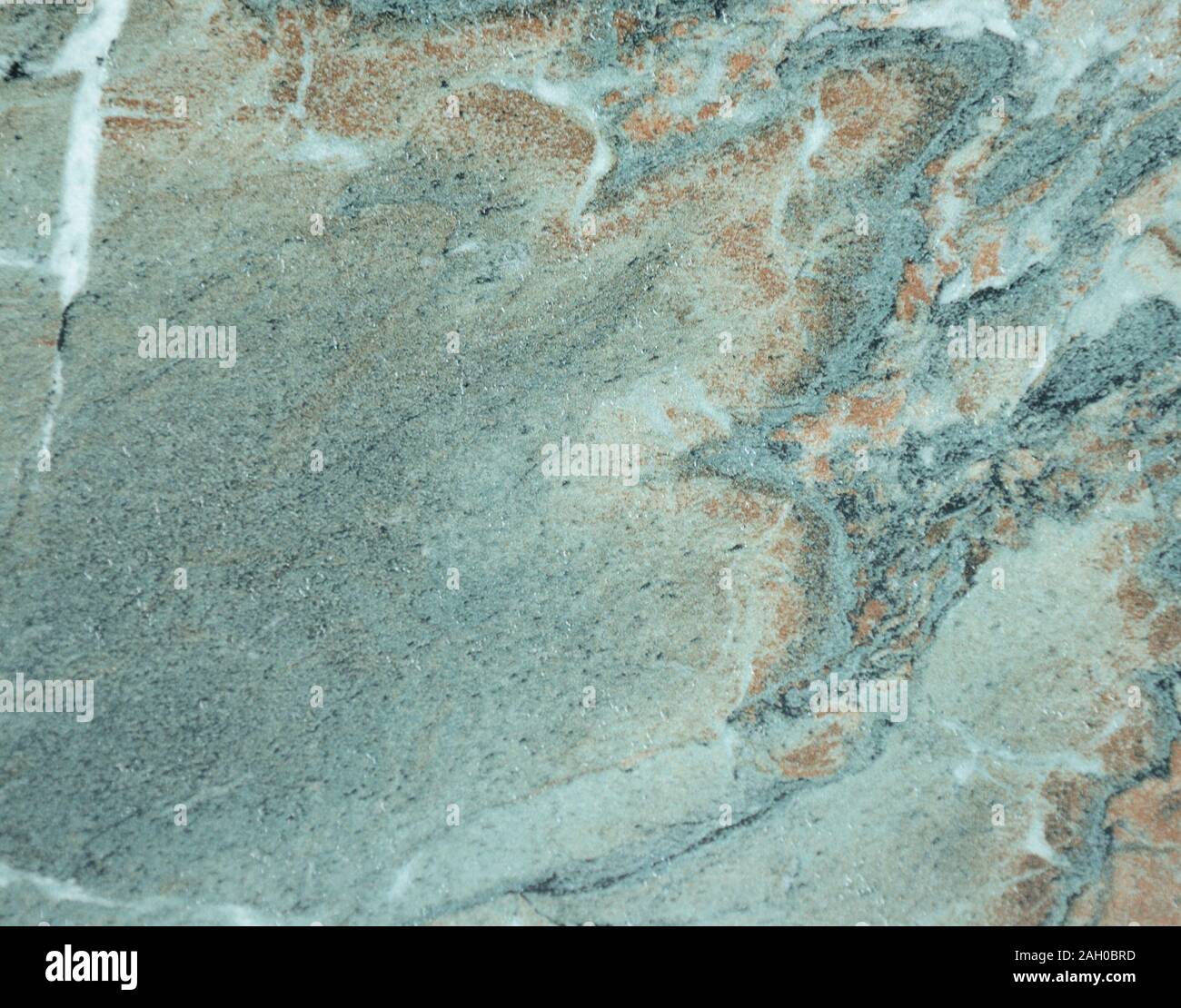 Green marble with white and brown spots, polished surface of natural ...
