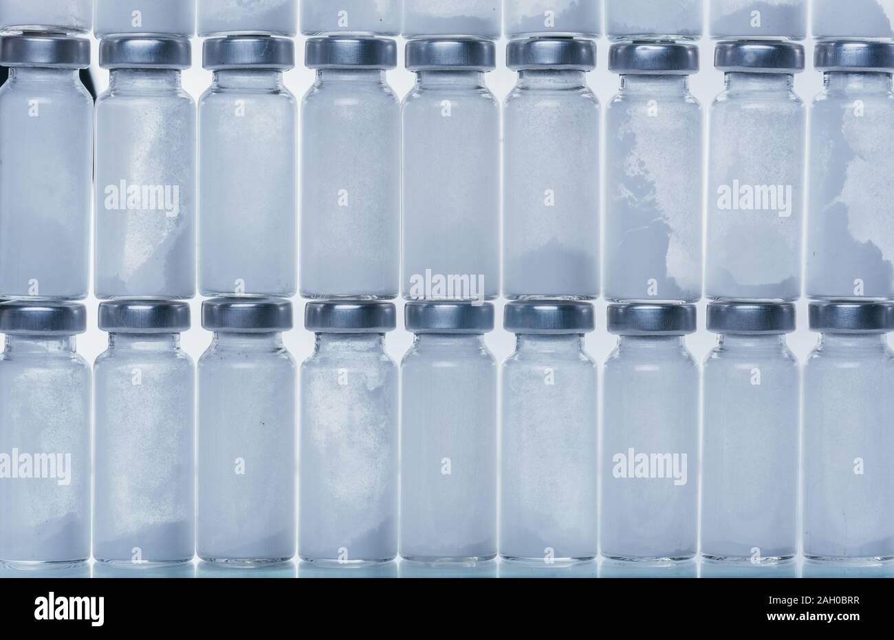 Glass medical ampoule vial for injection. Medicine is dry white drug ...