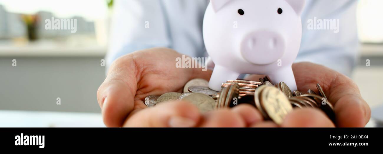 Hand businessman putting pin money Stock Photo - Alamy