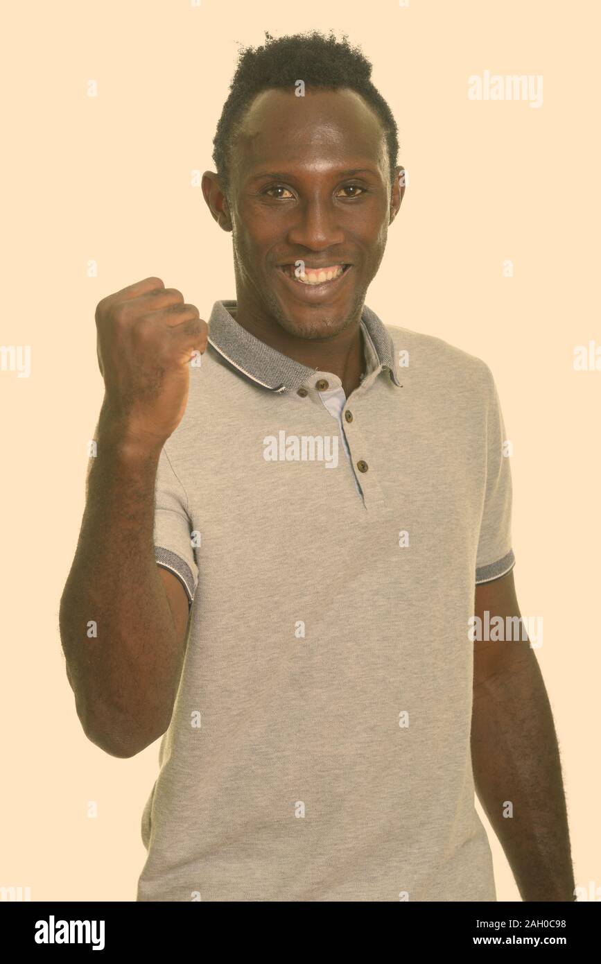 Young happy African man smiling and looking motivated Stock Photo - Alamy