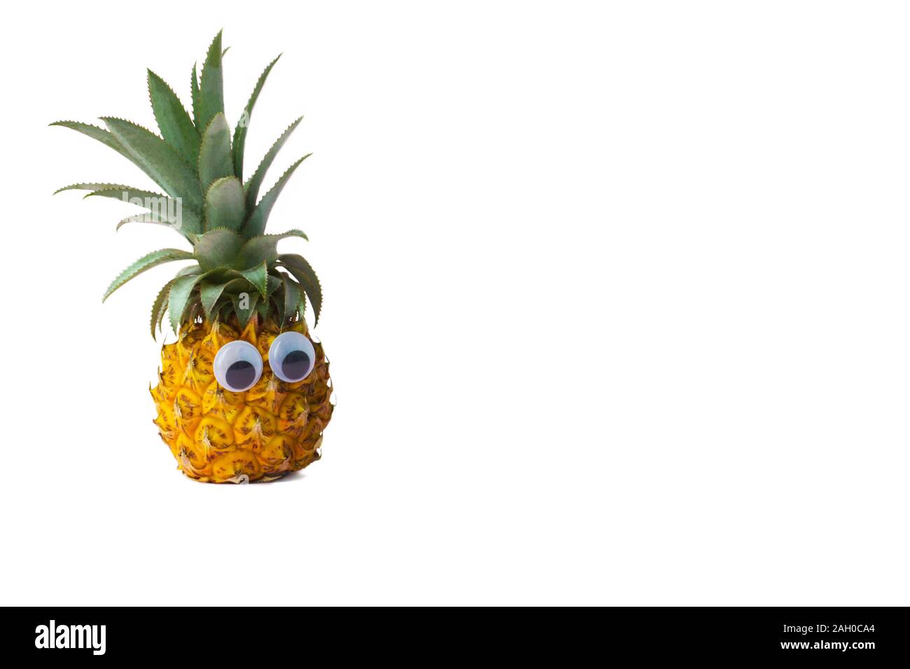 Isolated pineapple with googly eyes Stock Photo - Alamy