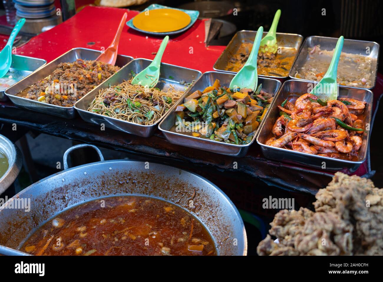 A selection of various street foods for sale in downtown Cebu City ...
