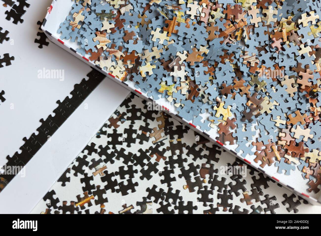 Mixed jigsaw puzzle pieces background, macro close up Stock Photo - Alamy