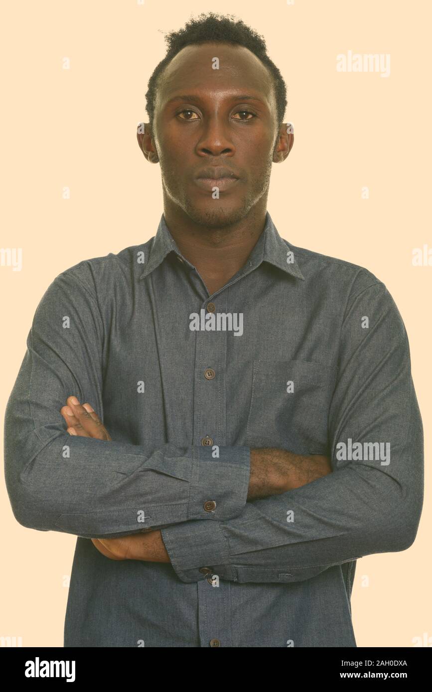 Young black African man with arms crossed Stock Photo - Alamy