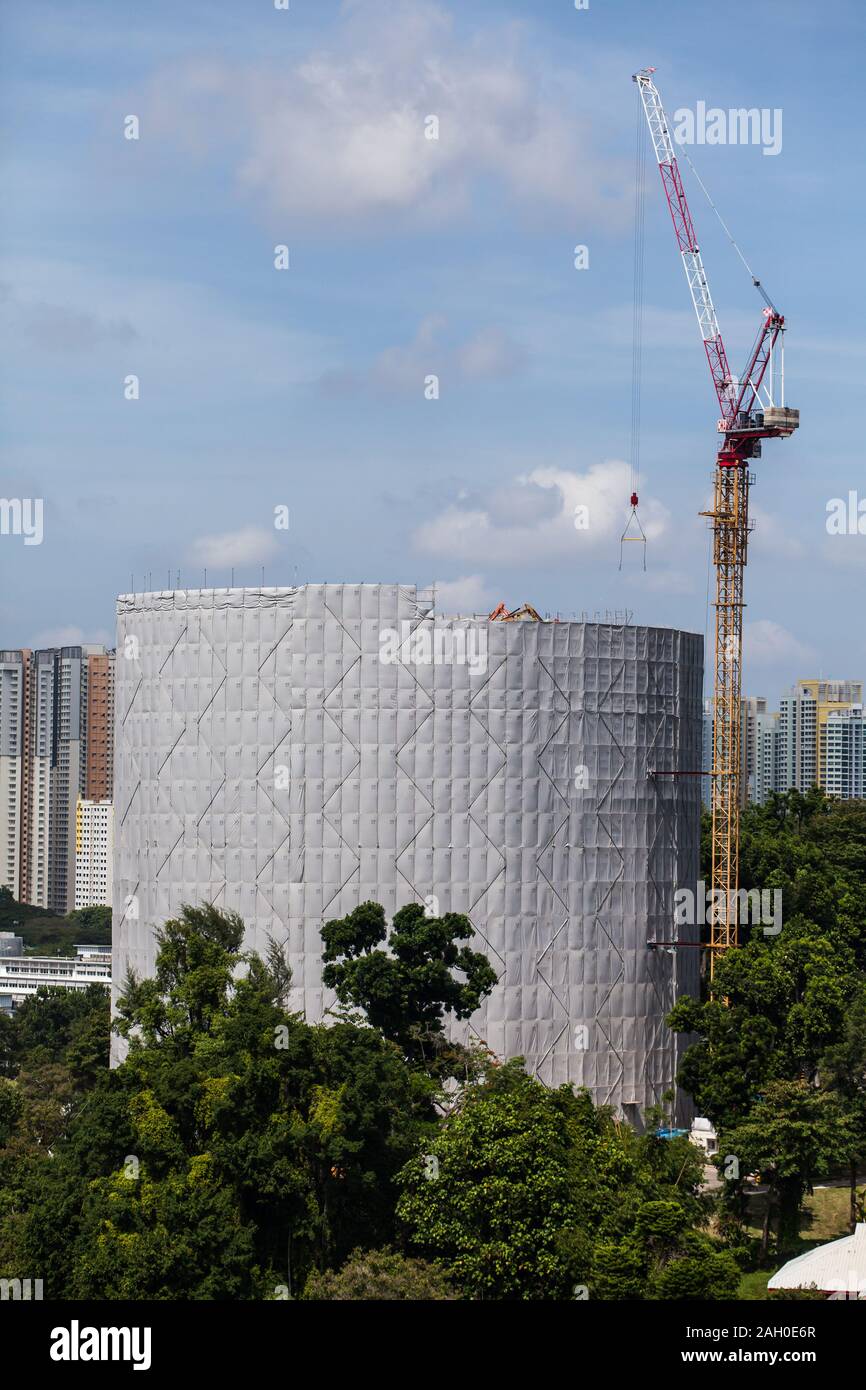 method of tearing down a tall building, Singapore Stock Photo - Alamy