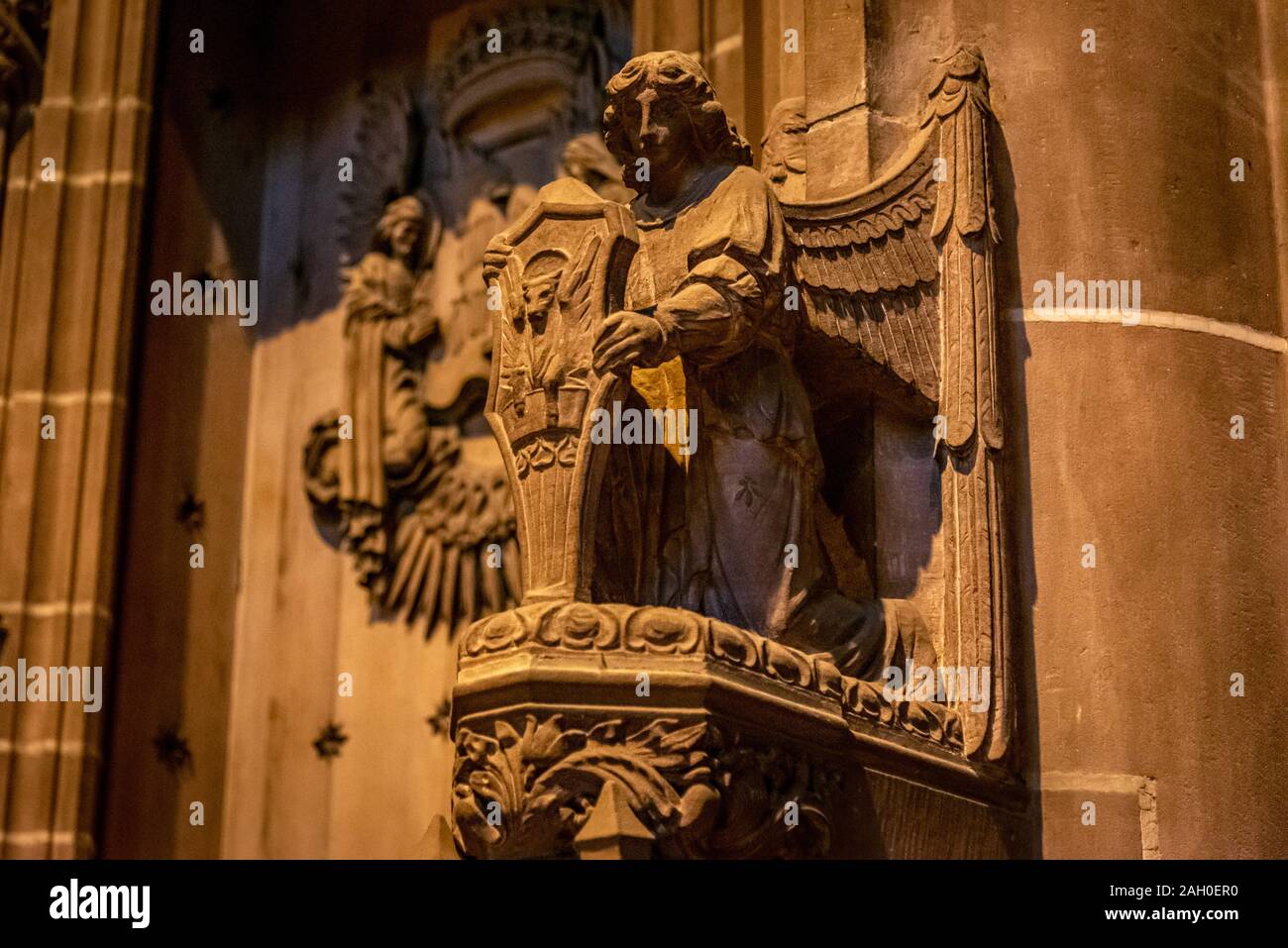 Small sculpture of an angel holding a shield with a pegasus on it from ...