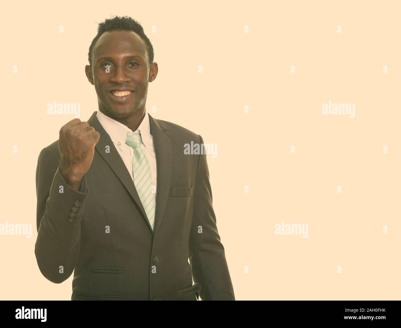 Young happy black African businessman looking motivated Stock Photo - Alamy