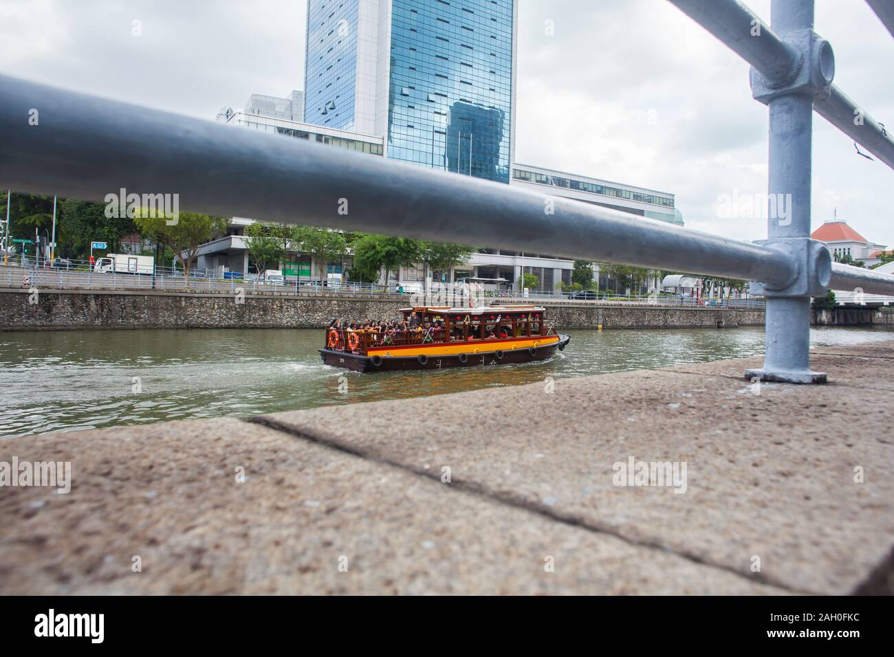 Low angle view bum boat cruise filled withIndia tourists and various ...