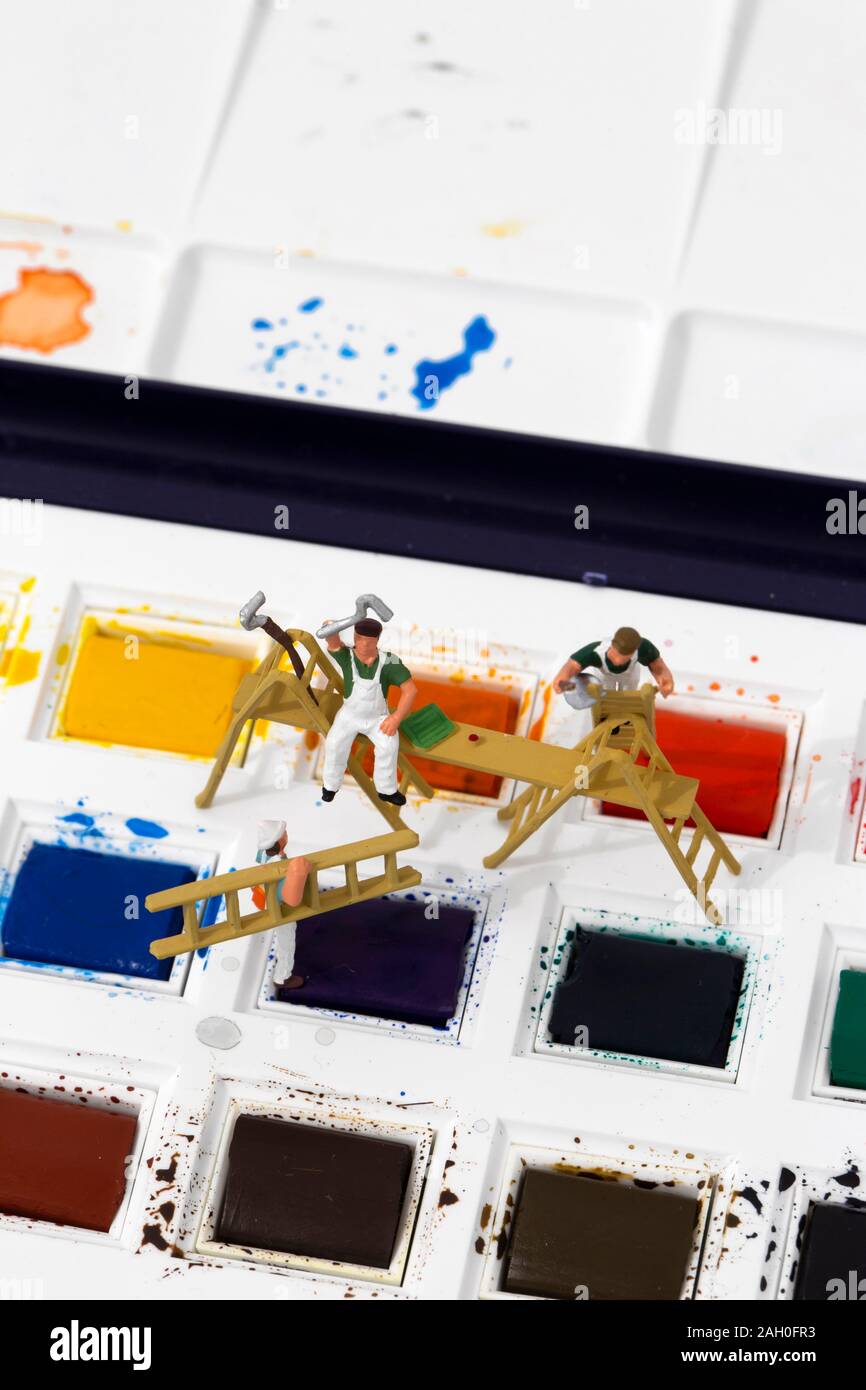 Miniature scale model painters decorators on a watercolour palette set ...