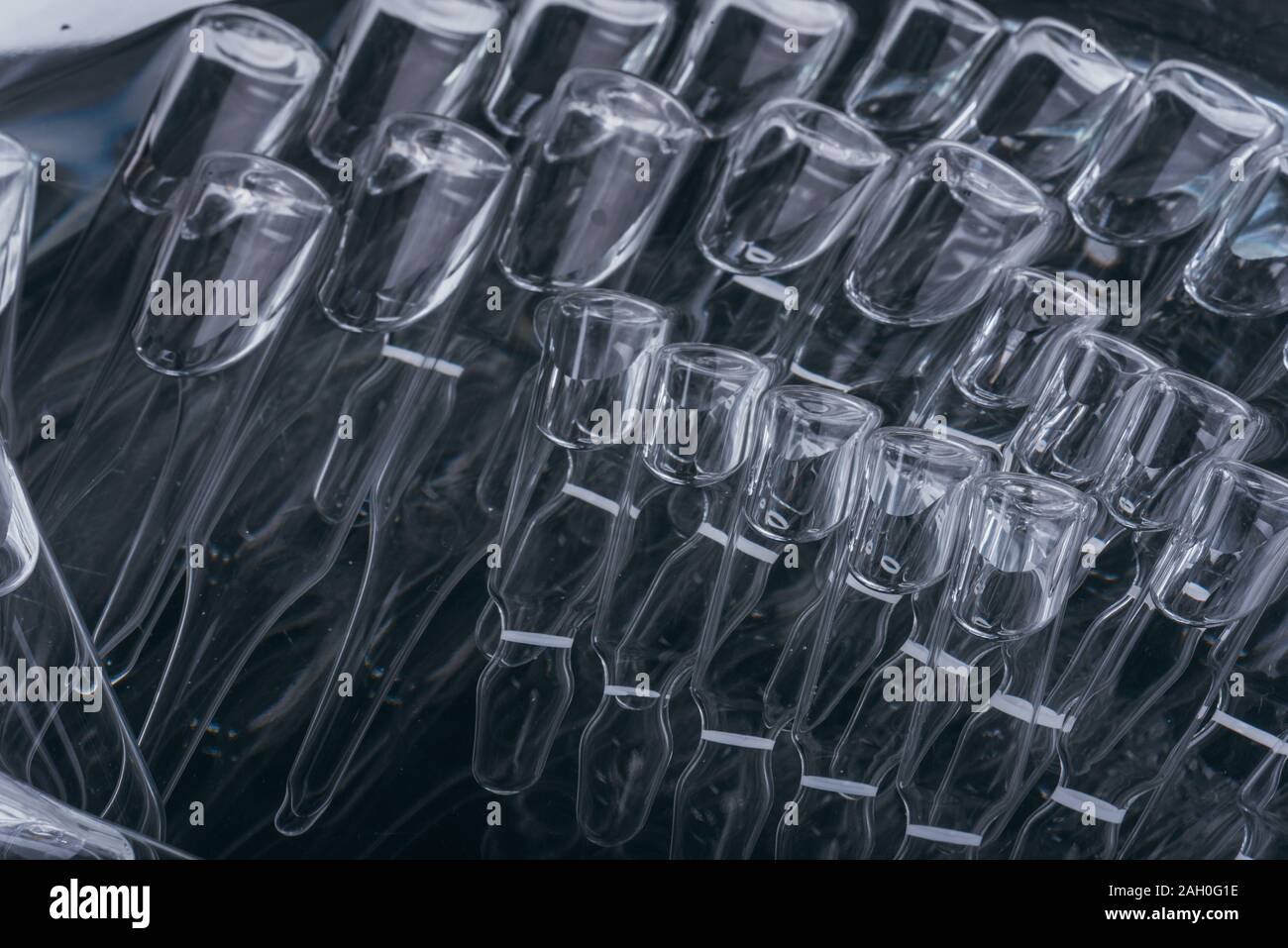Glass medical ampoule vial for injection. Medicine is liquid sodium ...