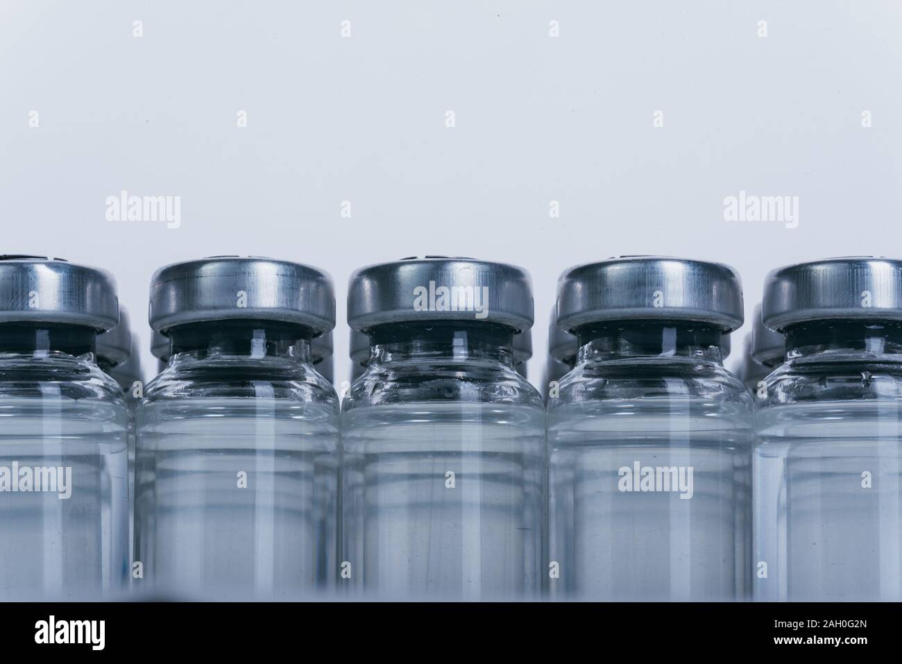 Glass medical ampoule vial for injection. Medicine is dry white drug ...