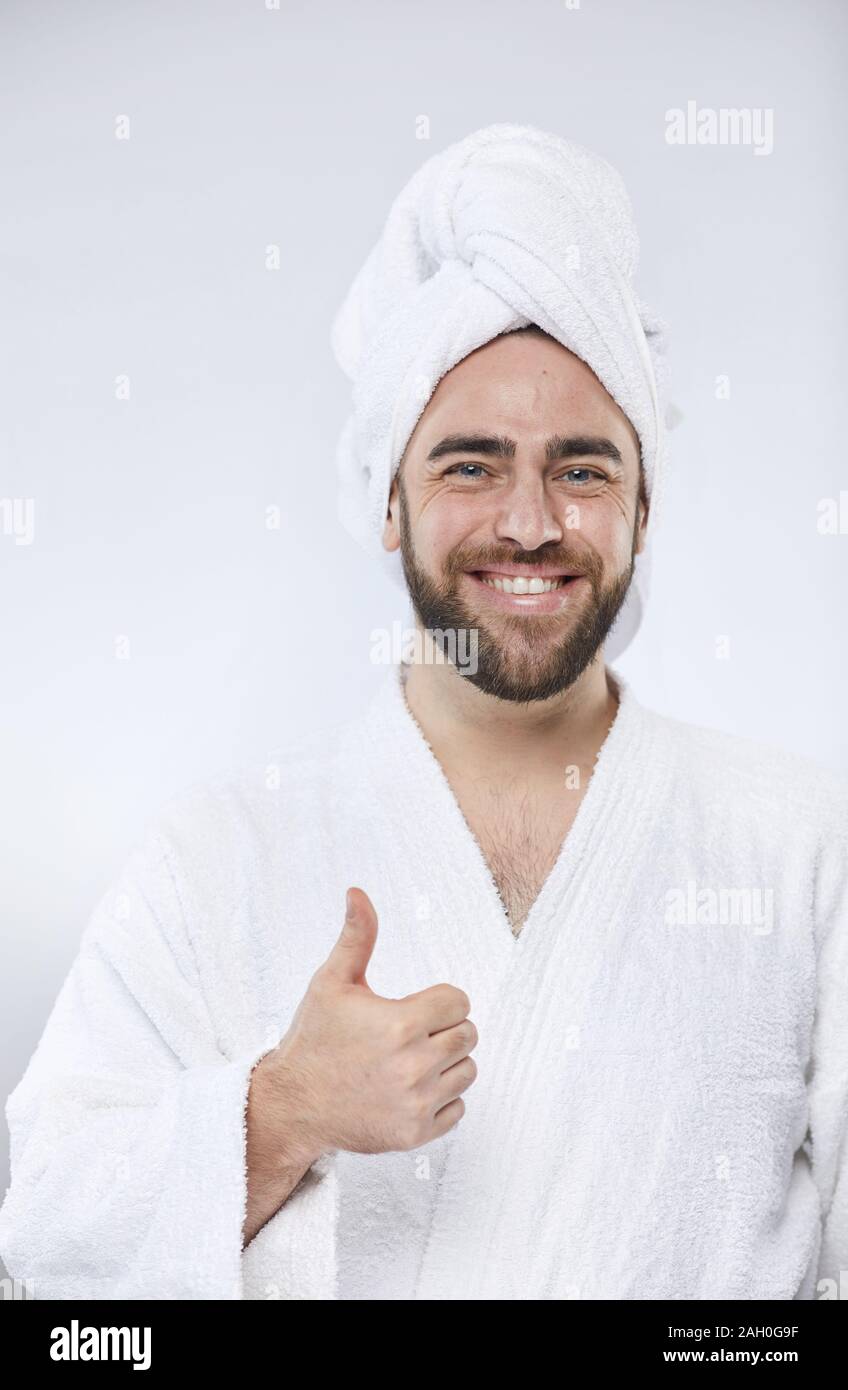 Handsome young man wearing white bathrobe hi-res stock photography and ...