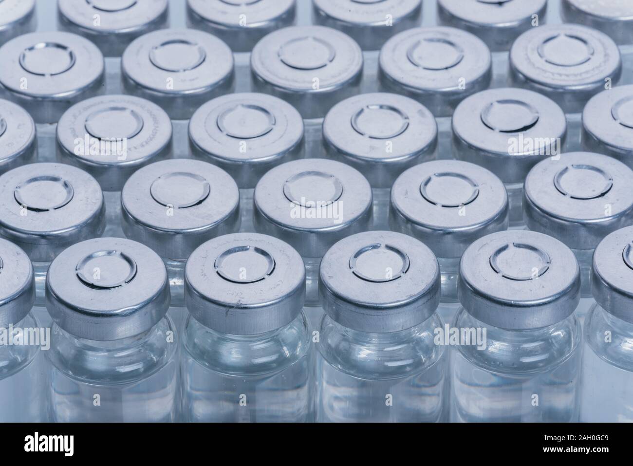 Glass medical ampoule vial for injection. Medicine is dry white drug ...