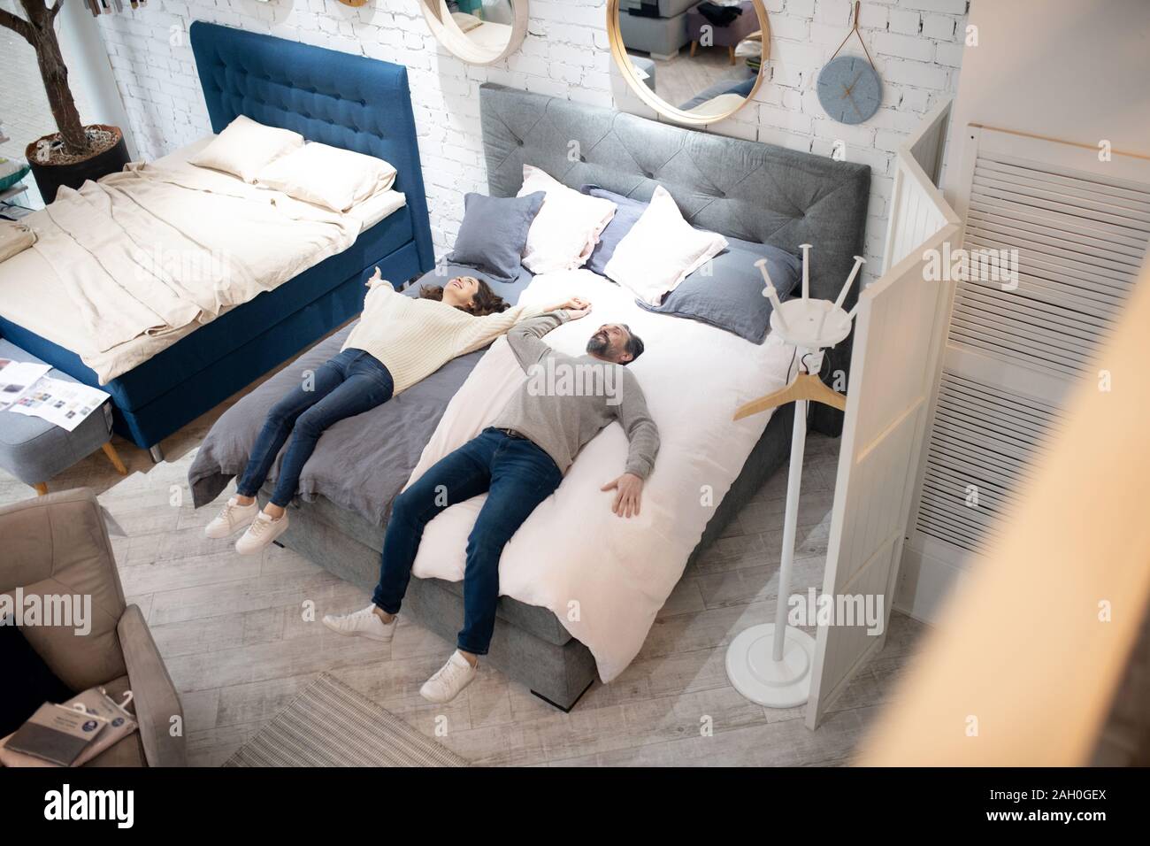 Married couple laying on bed hi-res stock photography and images - Alamy