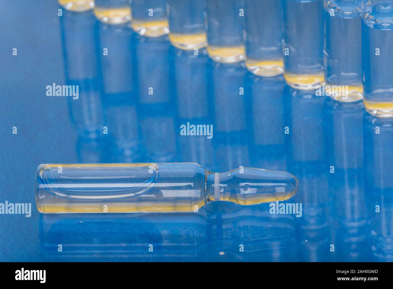 Glass medical ampoule vial for injection. Medicine is liquid sodium ...