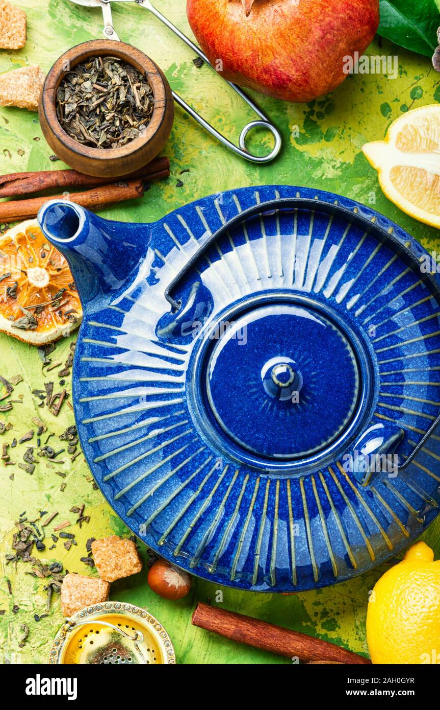 Natural ingredients for tea.Porcelain blue teapot.Useful tea with lemon ...