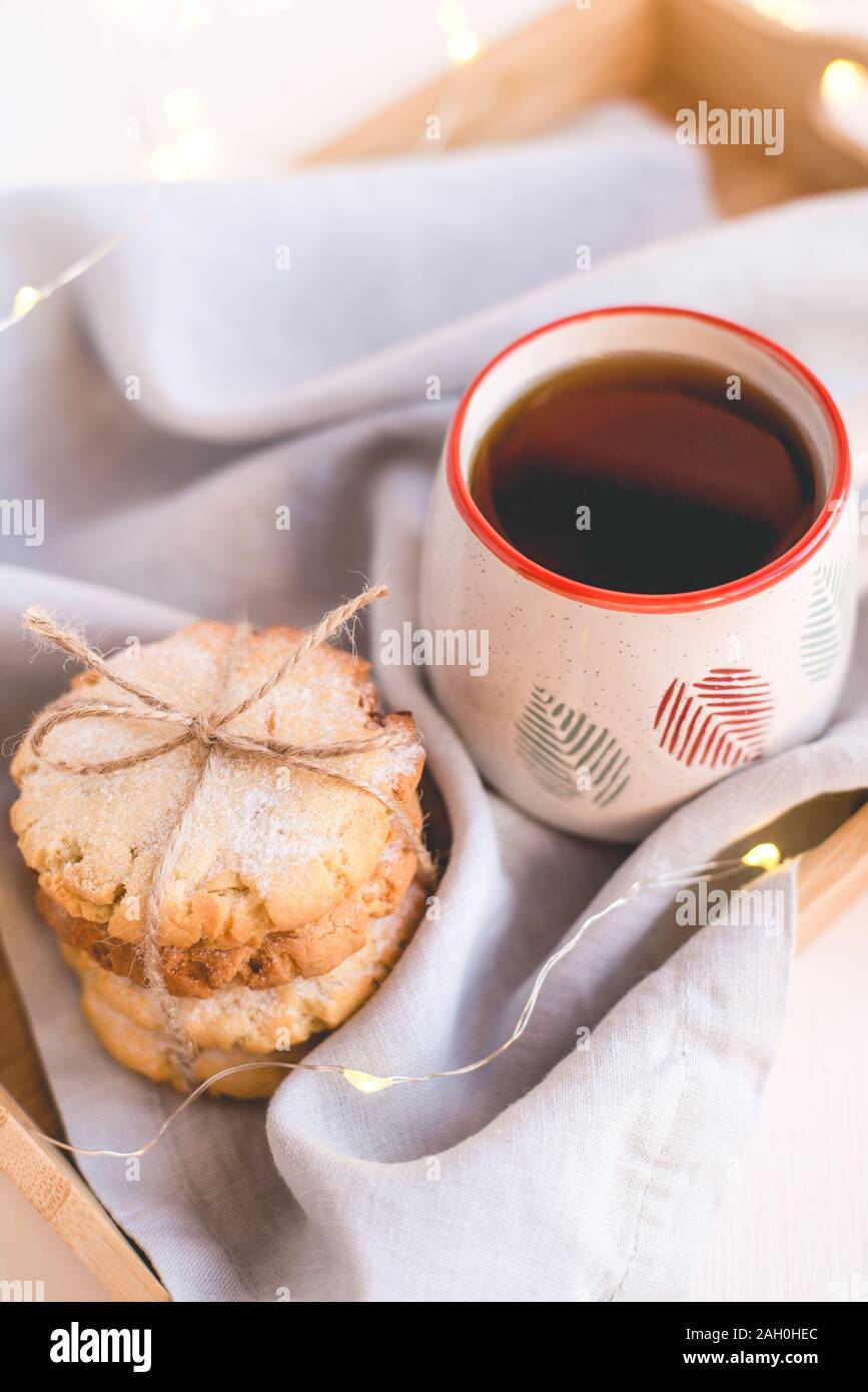 Fresh cookies and cup of tea on a wooden tray Stock Photo - Alamy