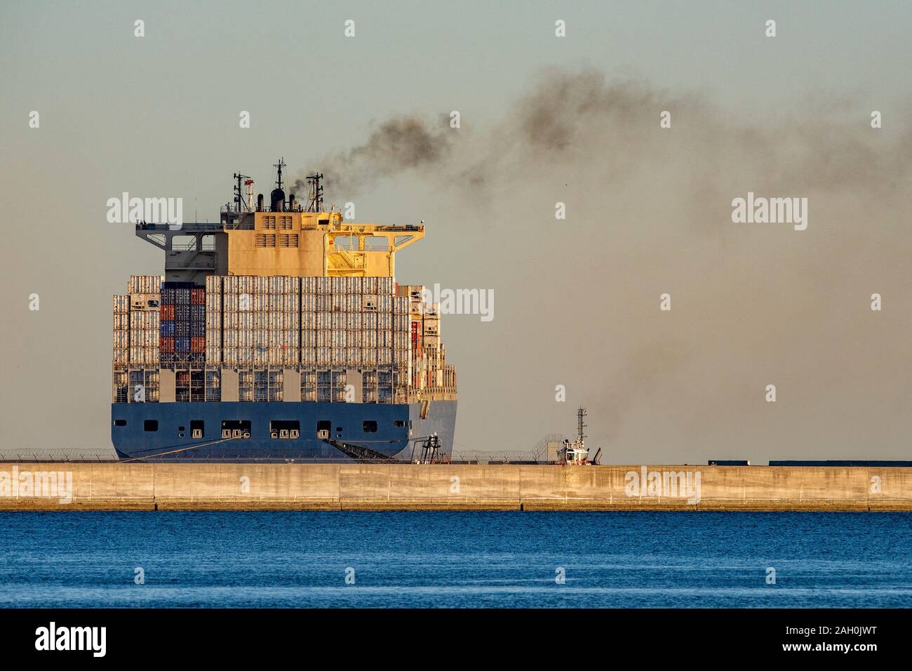 Container ship while docking in genoa harbor Italy Stock Photo - Alamy