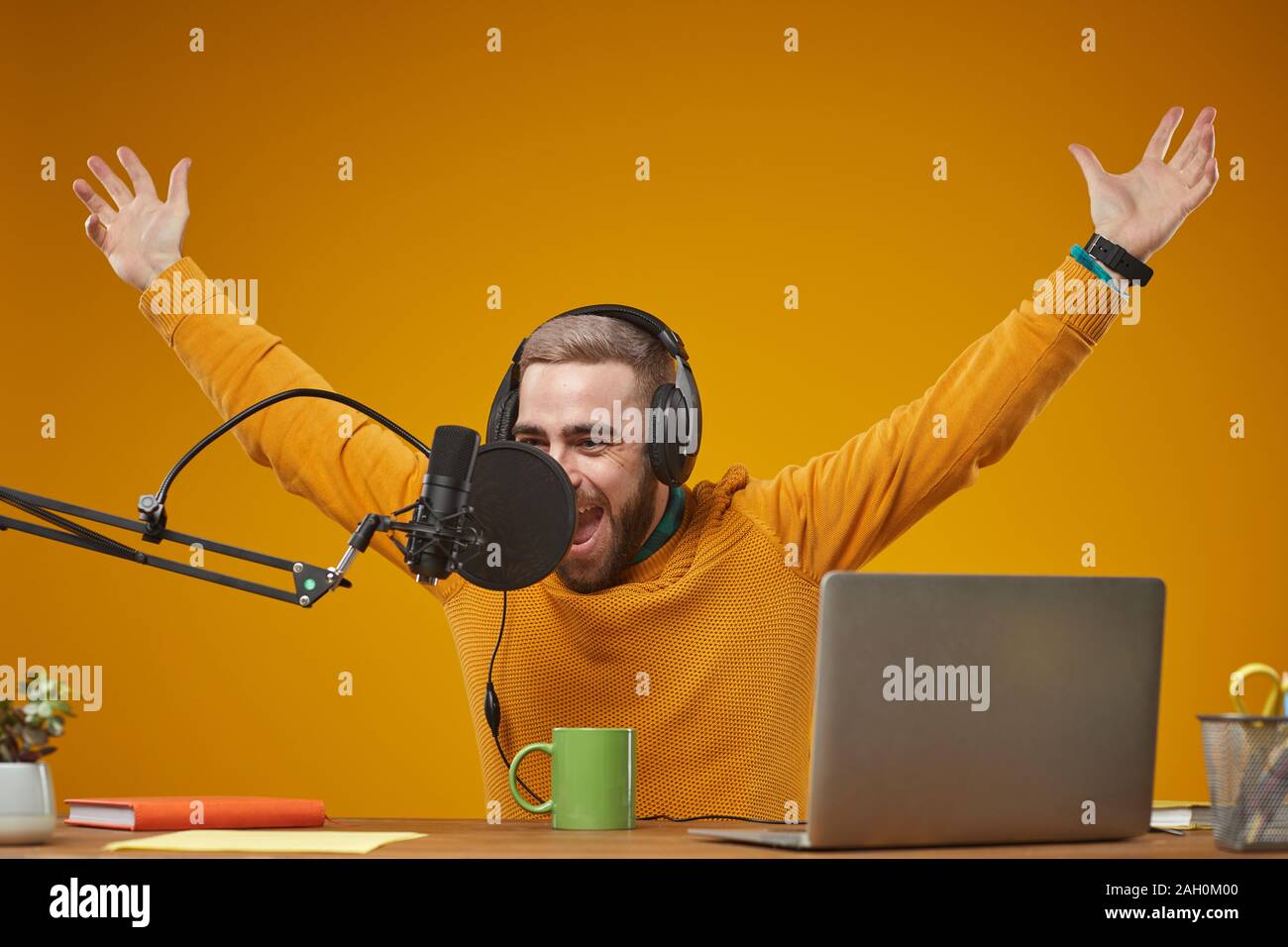 Man headphones and microphone smiling hi-res stock photography and ...