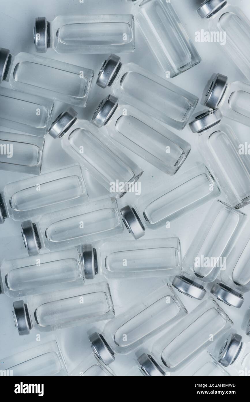 Glass medical ampoule vial for injection. Medicine is dry white drug ...