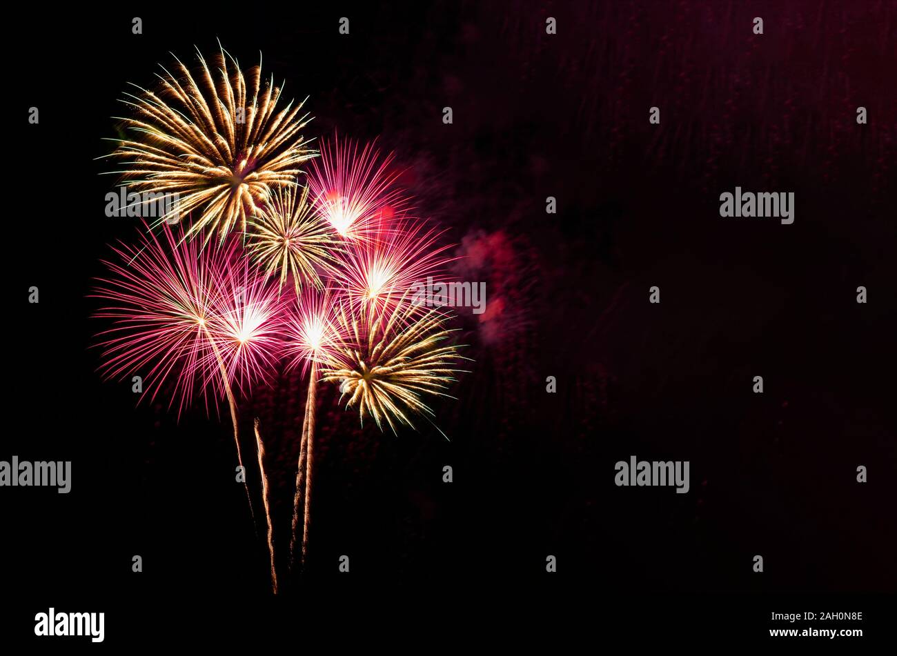 Closed-up of fireworks background with gold fireworks on dark ...