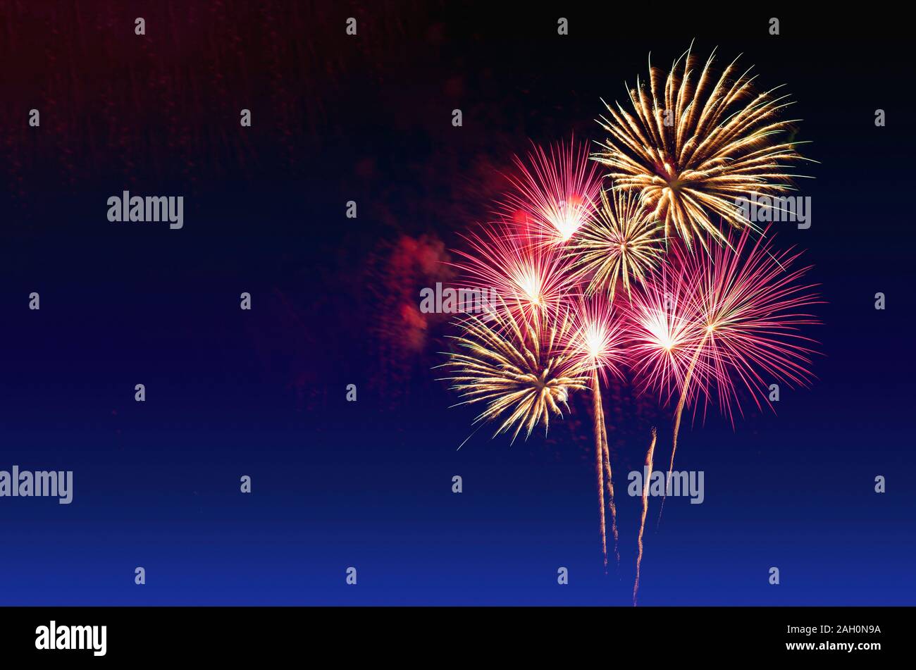 Closed-up of fireworks background with gold fireworks on dark ...