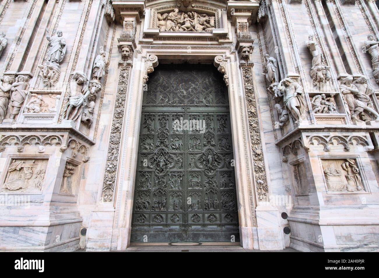 Cathedral of Milan. Catholic church in Italy. Gothic facade an brass ...