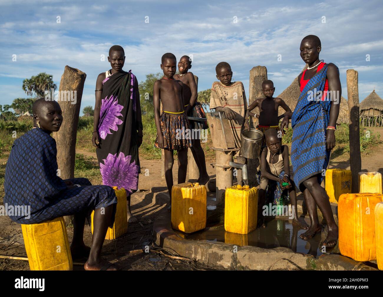 Mundari tribe women pumping water in a well, Central Equatoria ...