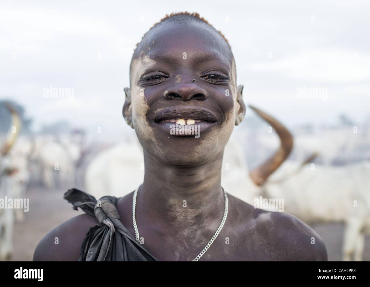Mundari tribe boy covered in ash to protect from the mosquitoes and flies, Central Equatoria ...