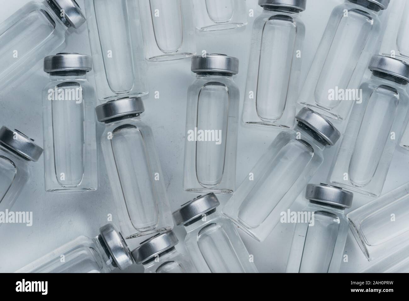 Glass medical ampoule vial for injection. Medicine is dry white drug ...