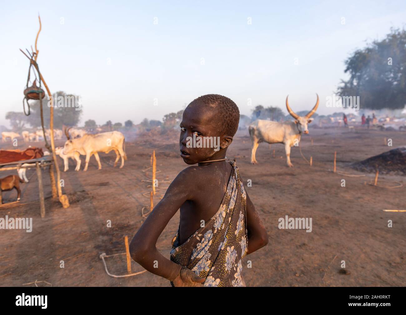 Mundari tribe boy taking care of the long horns cows in the camp, Central Equatoria, Terekeka ...