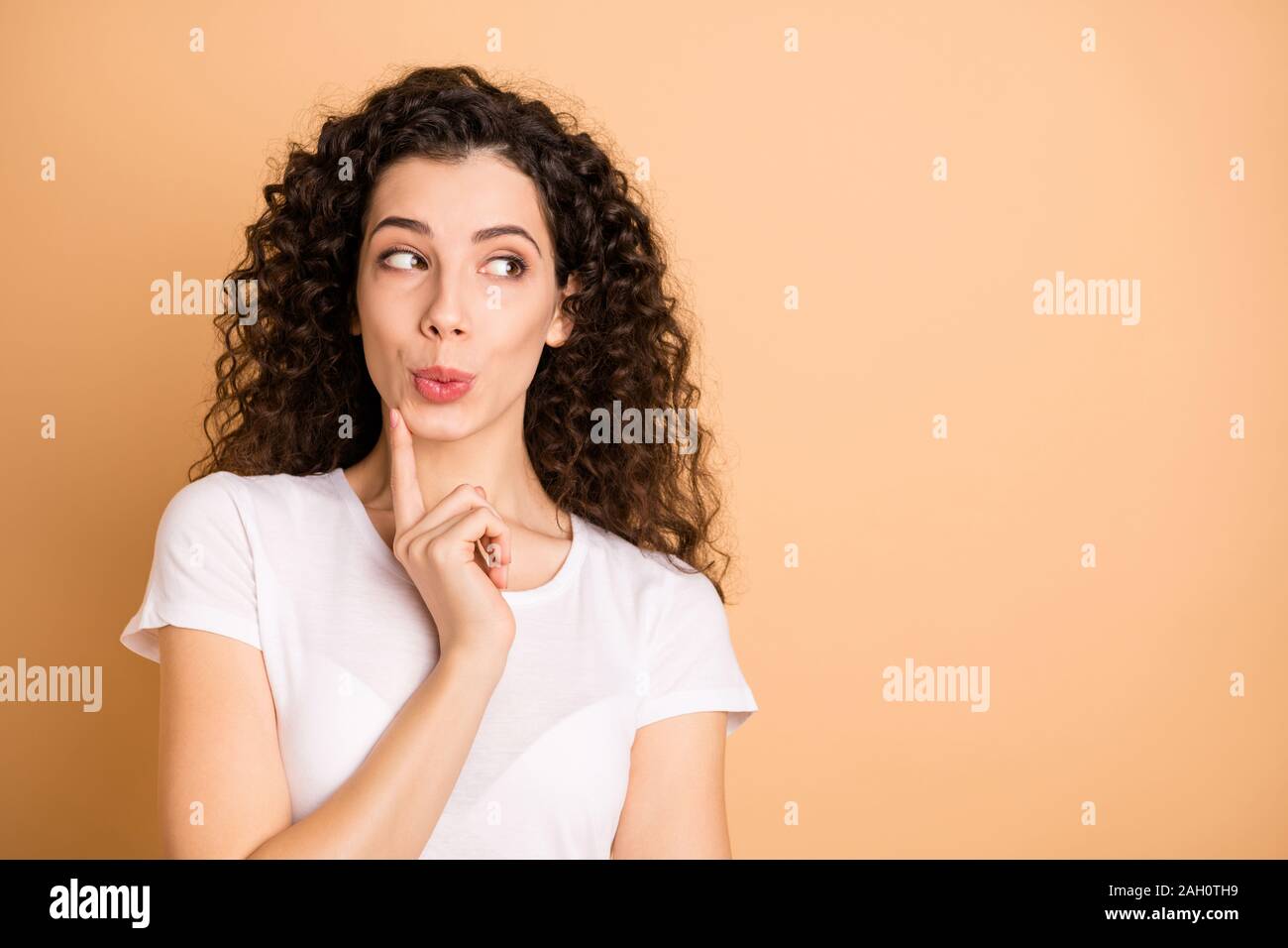 Closeup photo of amazing lady holding finger on chin looking cunning ...